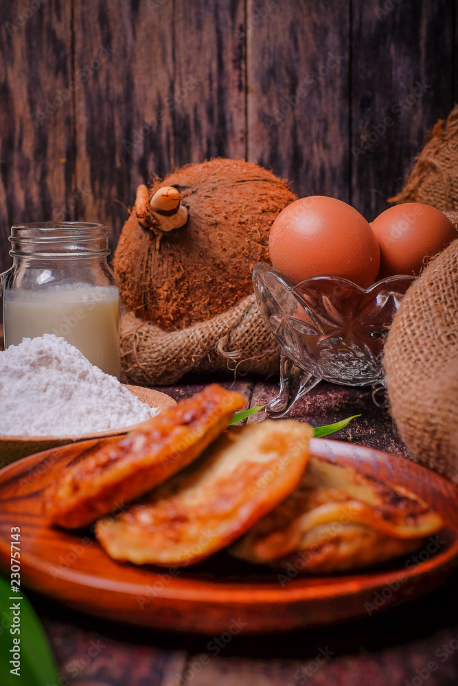 Akok Kedut, egg, coconut, flour , coconut milk and Pandan leaf on ...