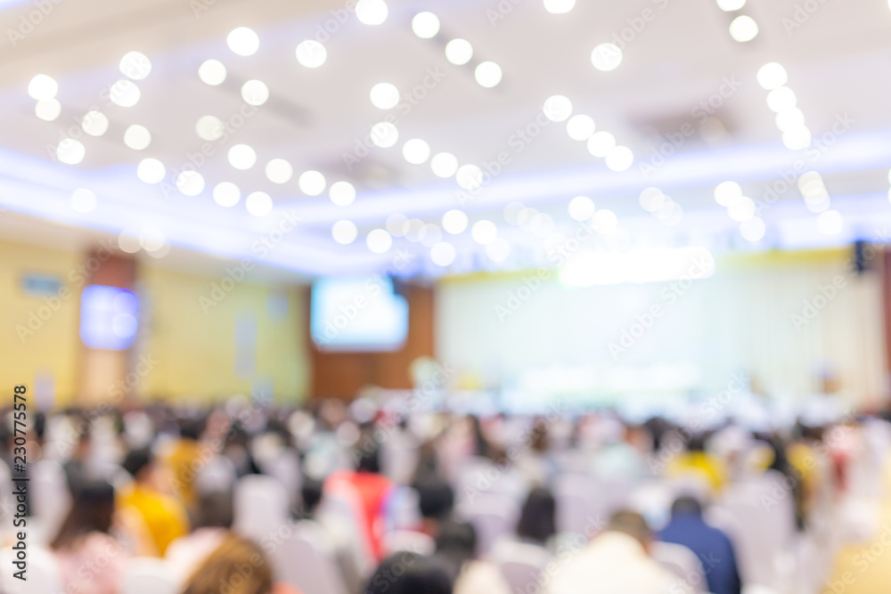 Abstract blurred photo of conference hall or seminar room with attendee ...