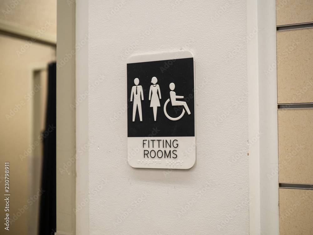 Male and female fitting room sign to entrance in department store Stock ...