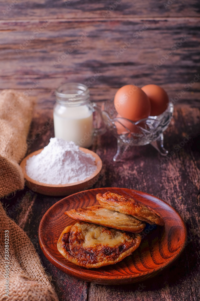 Akok Kedut, egg, coconut, flour , coconut milk and Pandan leaf on ...