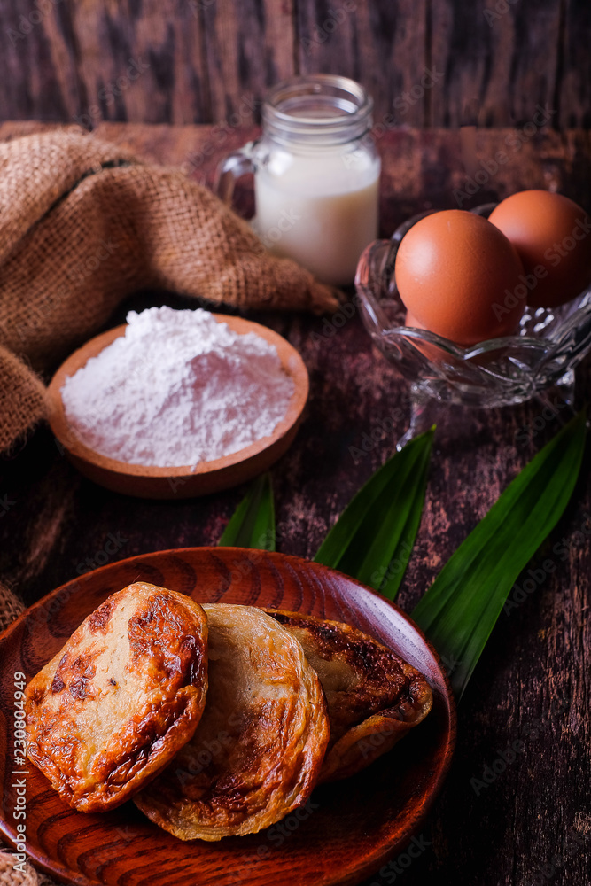 Akok Kedut, egg, coconut, flour , coconut milk and Pandan leaf on ...
