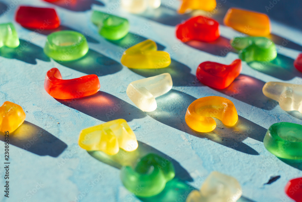 Shiny gummy letters from latin alphabet on a blue background Stock ...