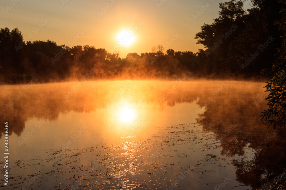 View of river in the mist at sunrise. Fog over river at morning Stock ...