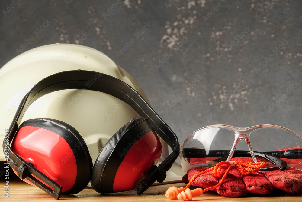 Safety Personal Protective Equipment(PPE) on a rustic black background ...