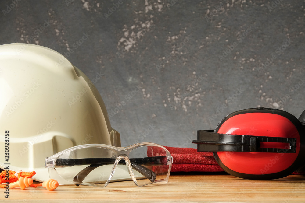 Safety Personal Protective Equipment(PPE) on a rustic black background ...