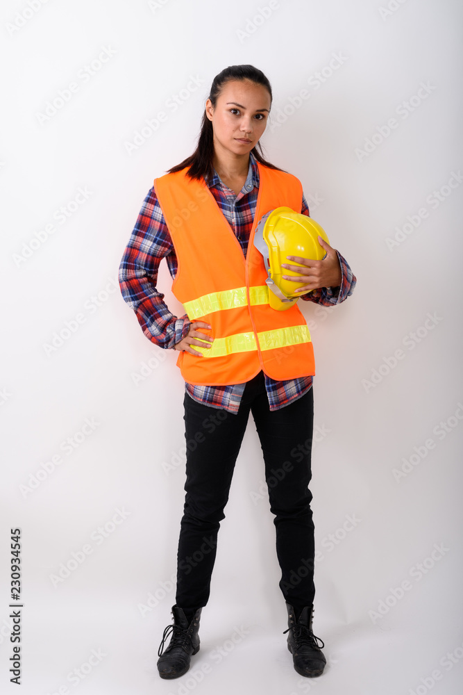 Full body shot of young Asian woman construction worker standing Stock ...