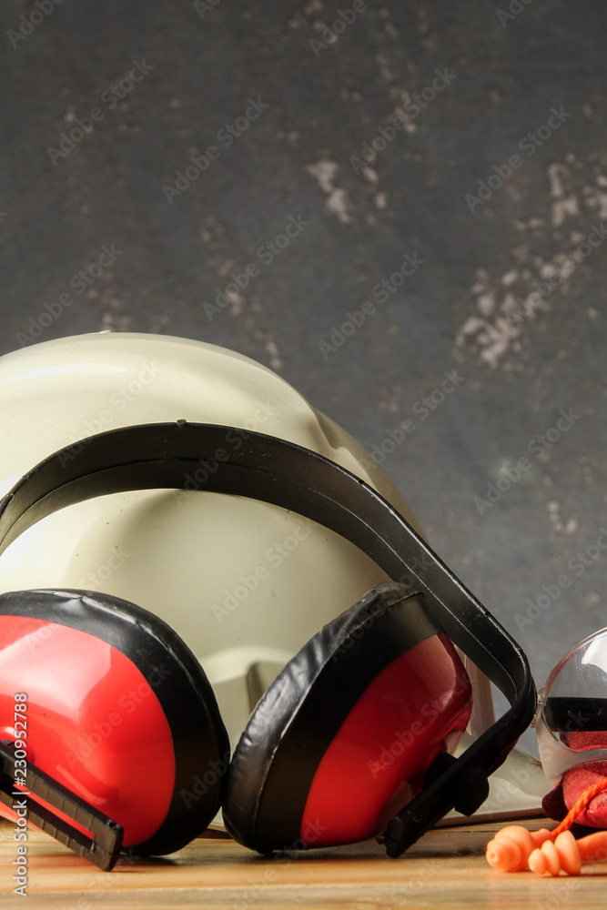 Safety Personal Protective Equipment(PPE) on a rustic black background ...