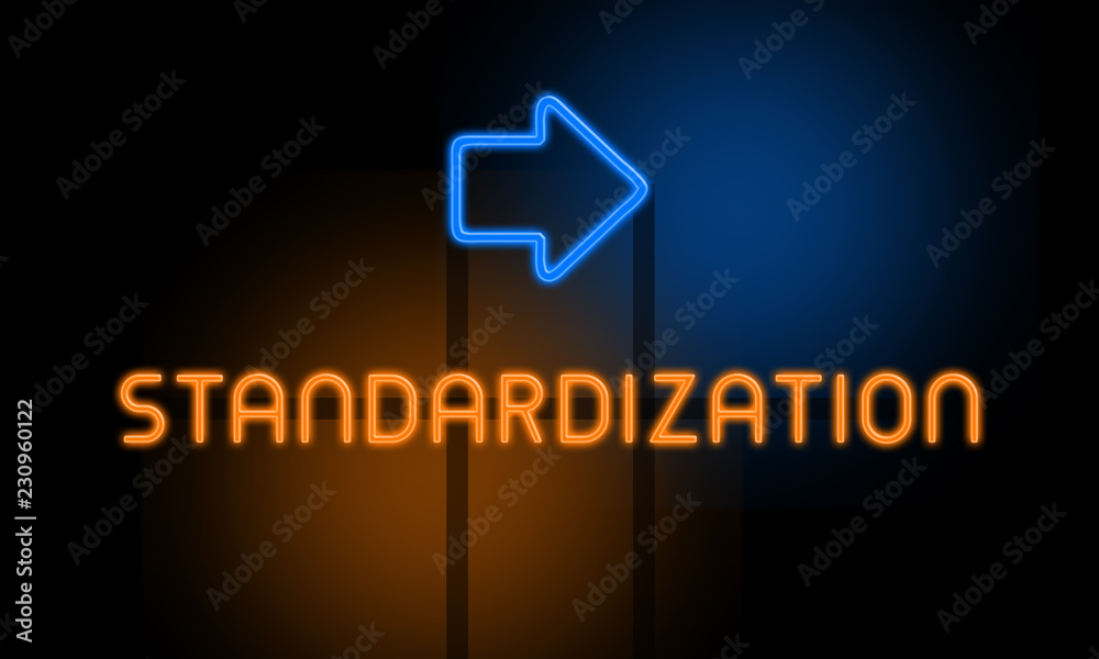 Standardization - orange glowing text with an arrow on dark background ...