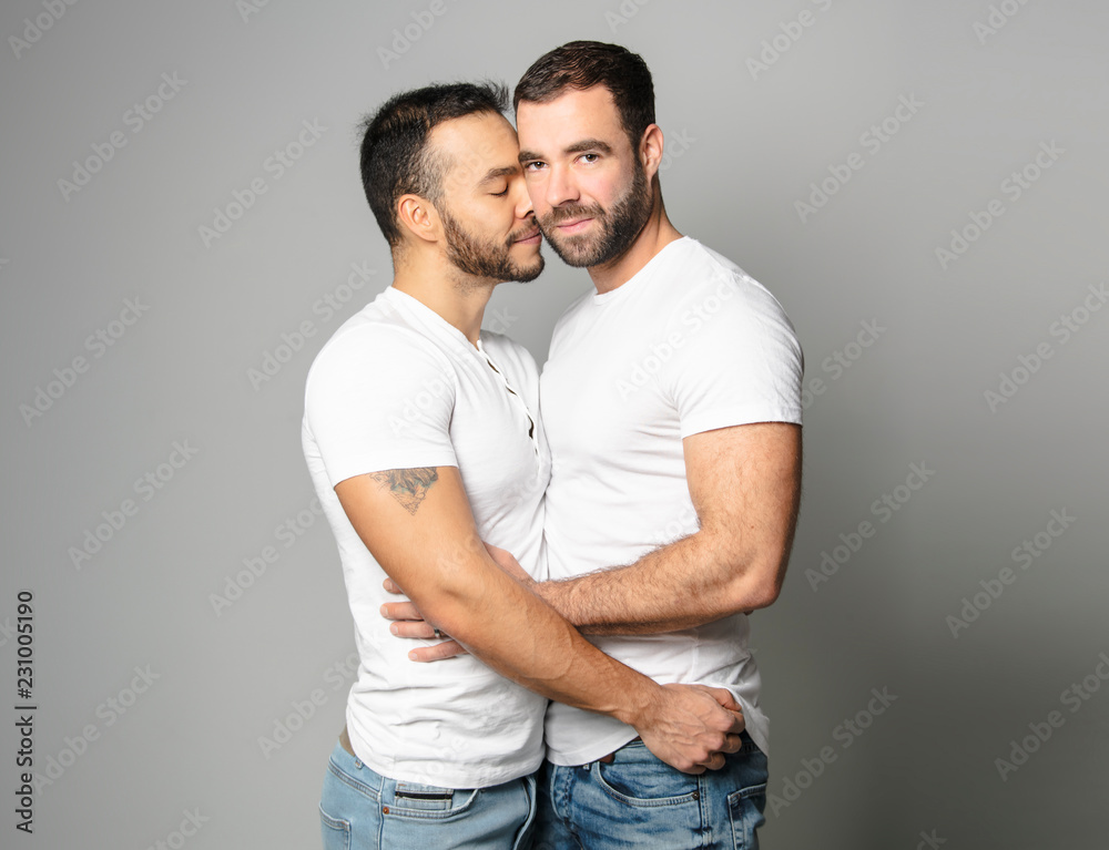 homosexual couple over a white background on studio Stock Photo | Adobe ...
