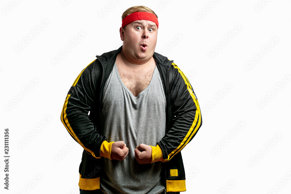 Worried fat guy in sports jacket and red headband staring at camera in ...