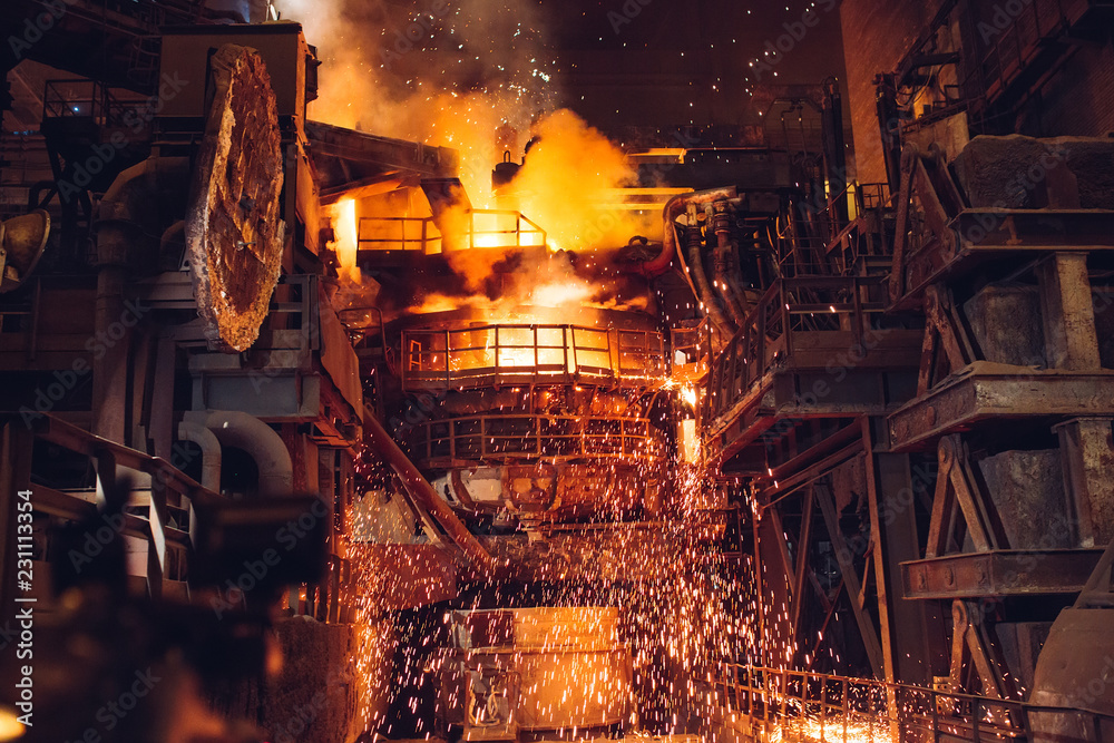 Melting of metal in a steel plant. High temperature in the melting ...