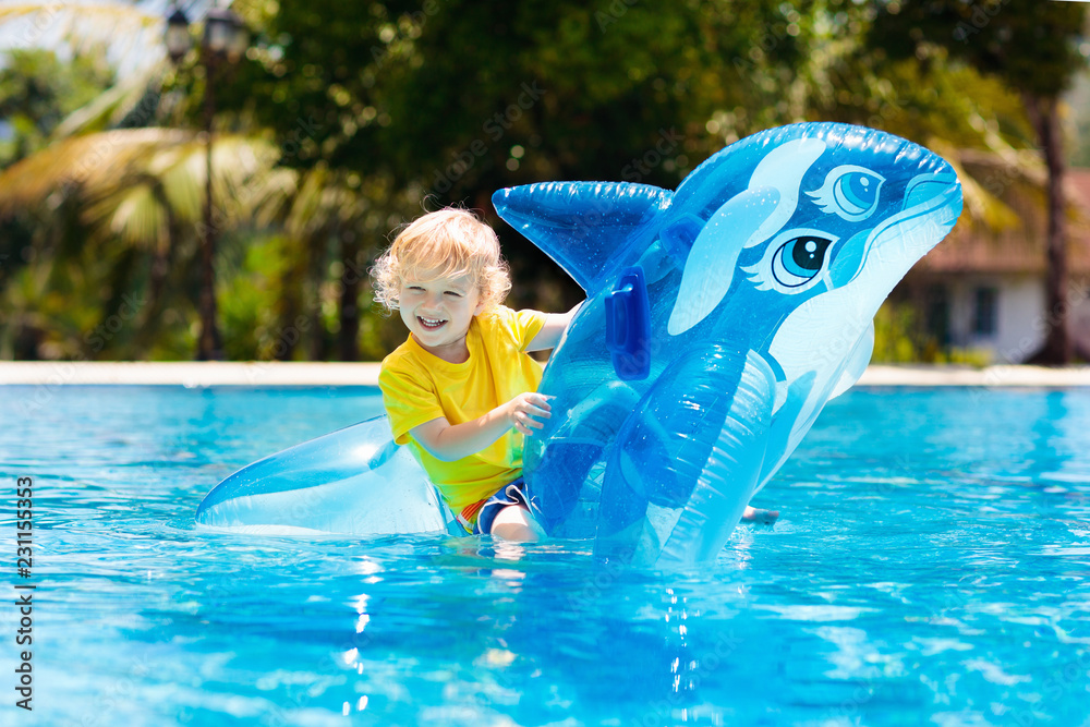 Child in swimming pool. Kid on inflatable float Stock Photo | Adobe Stock