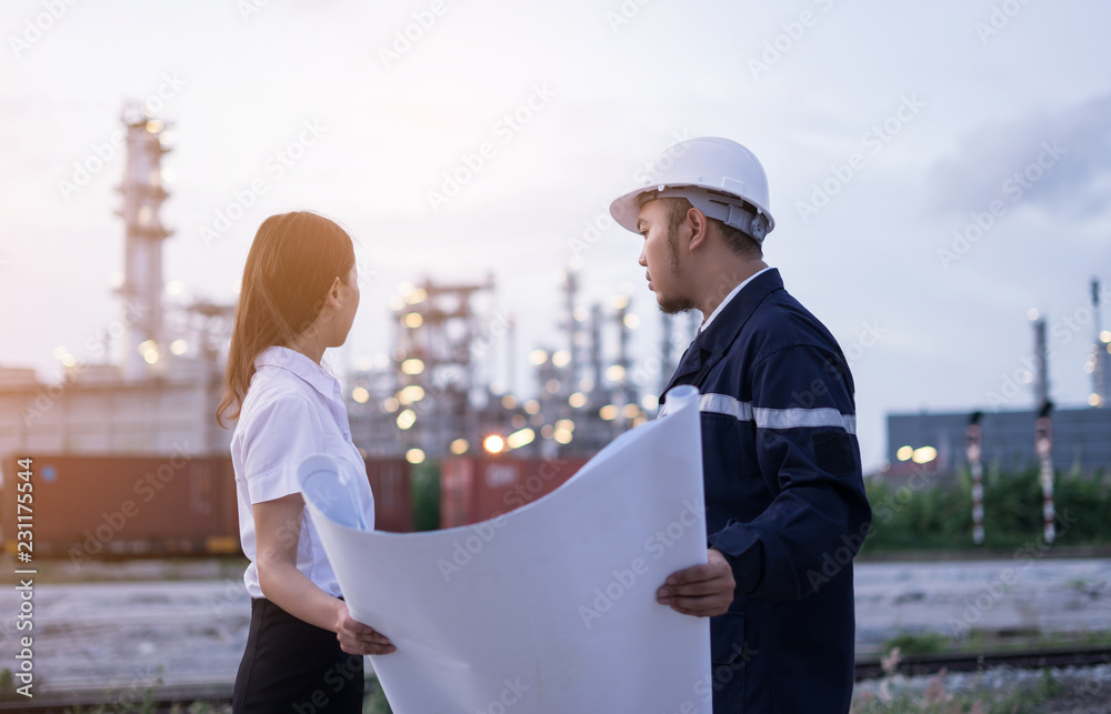 Engineer worker Concept working at oil refinery. Young Asian man and ...