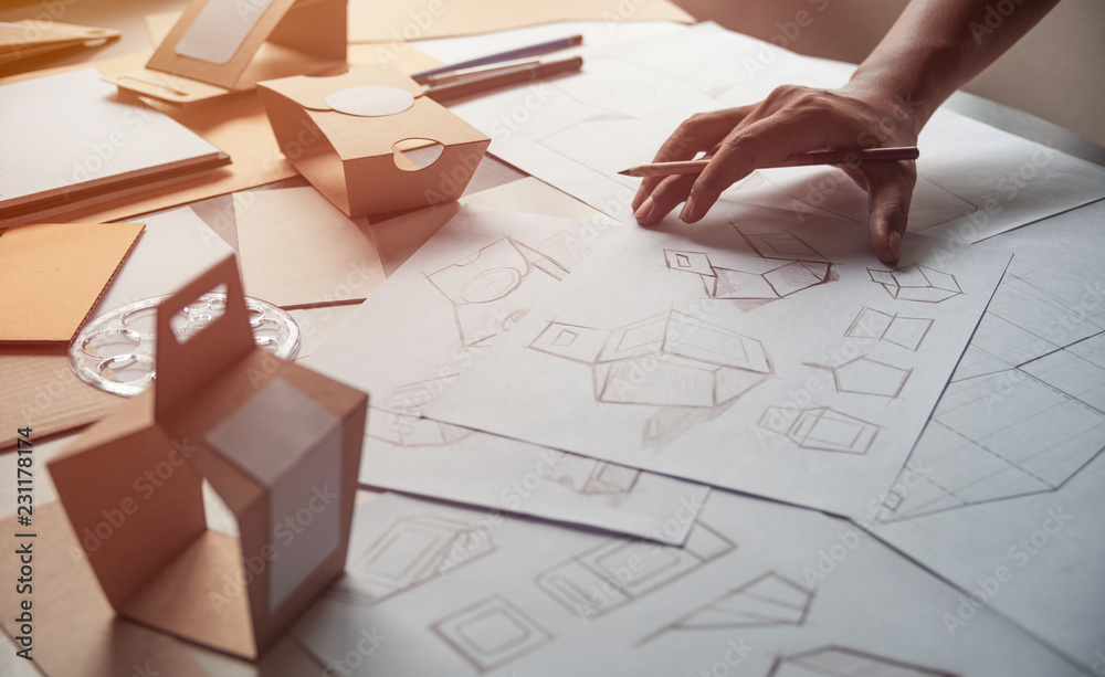 Designer sketching drawing design Brown craft cardboard paper product ...