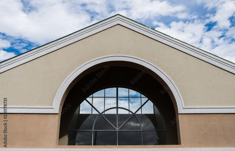 Angled rooftop with glass window design. Stucco stone industrial ...