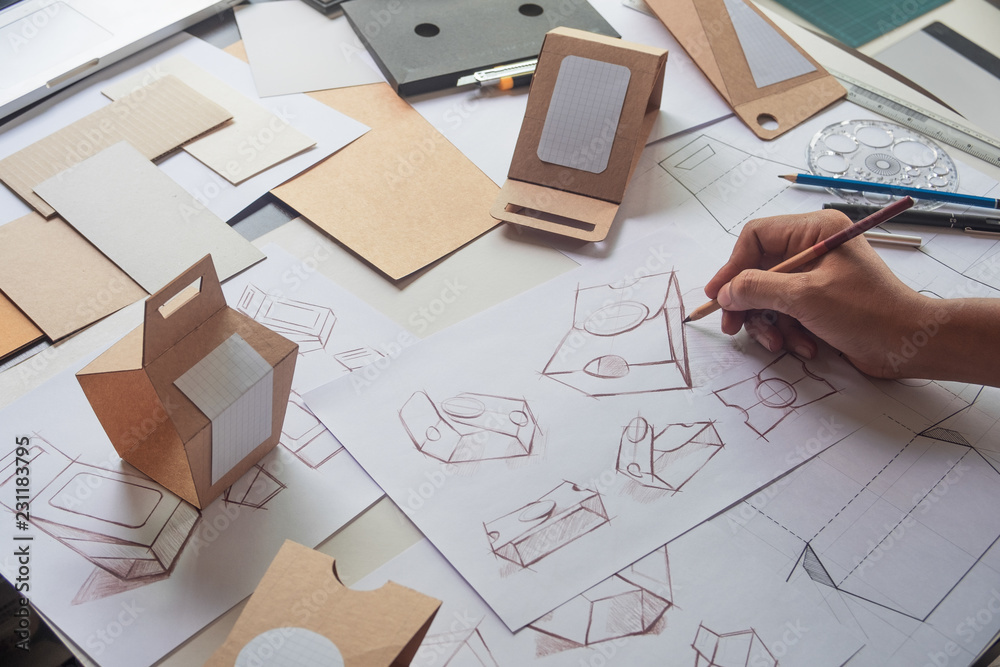 Designer sketching drawing design Brown craft cardboard paper product ...