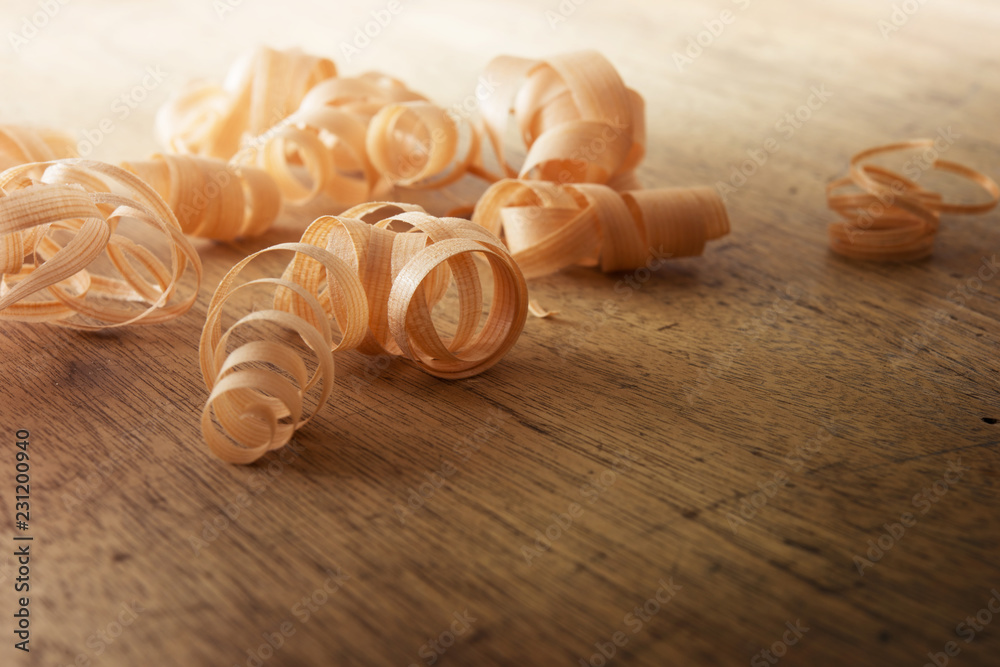 Beautiful wood shavings, on an old work desk. Shallow depth of field ...