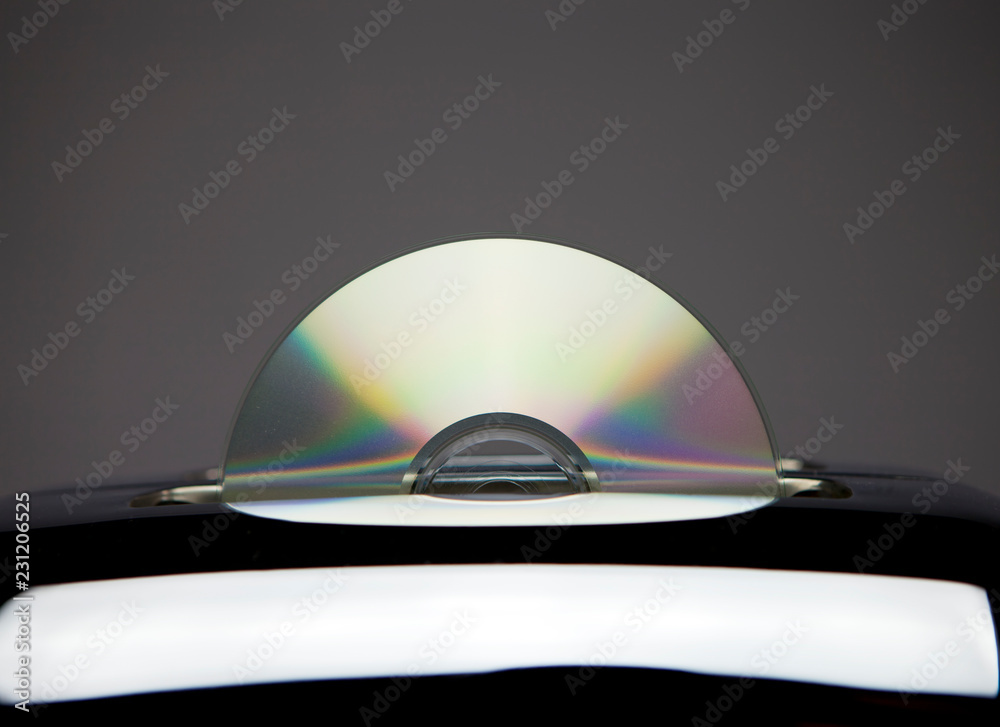 Toasting or burning a DVD or a CD-R disc. An optical disc popping out ...