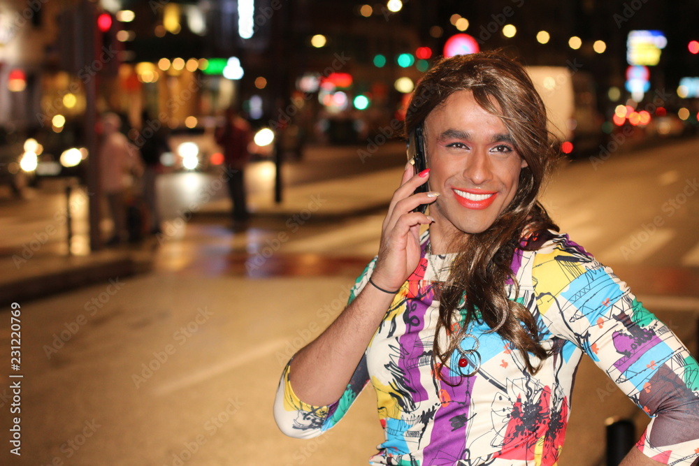 African American transgender woman calling by phone outdoors Stock ...