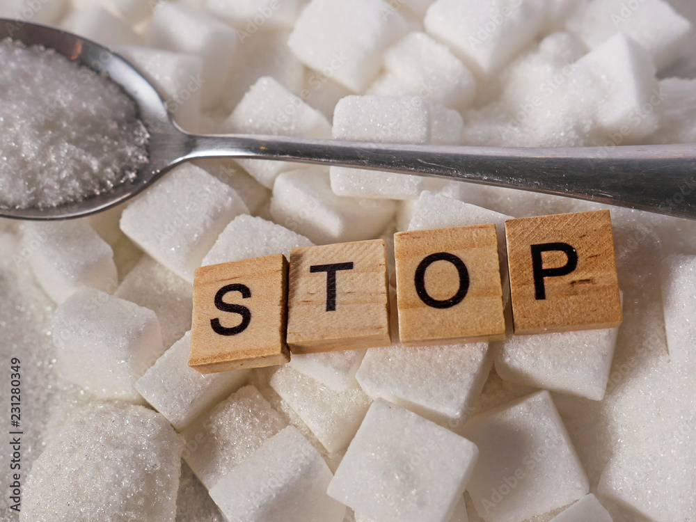 Stockfoto h pile of white sugar cubes and stop word in block letters as ...