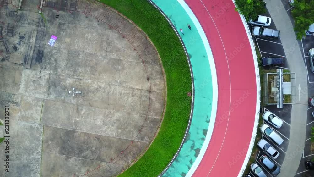 4K. Aerial view of velodrome with cyclists cycling on the track, a part ...