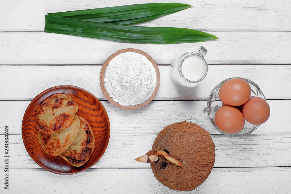 Akok Kedut, egg, coconut, flour , coconut milk and Pandan leaf on ...