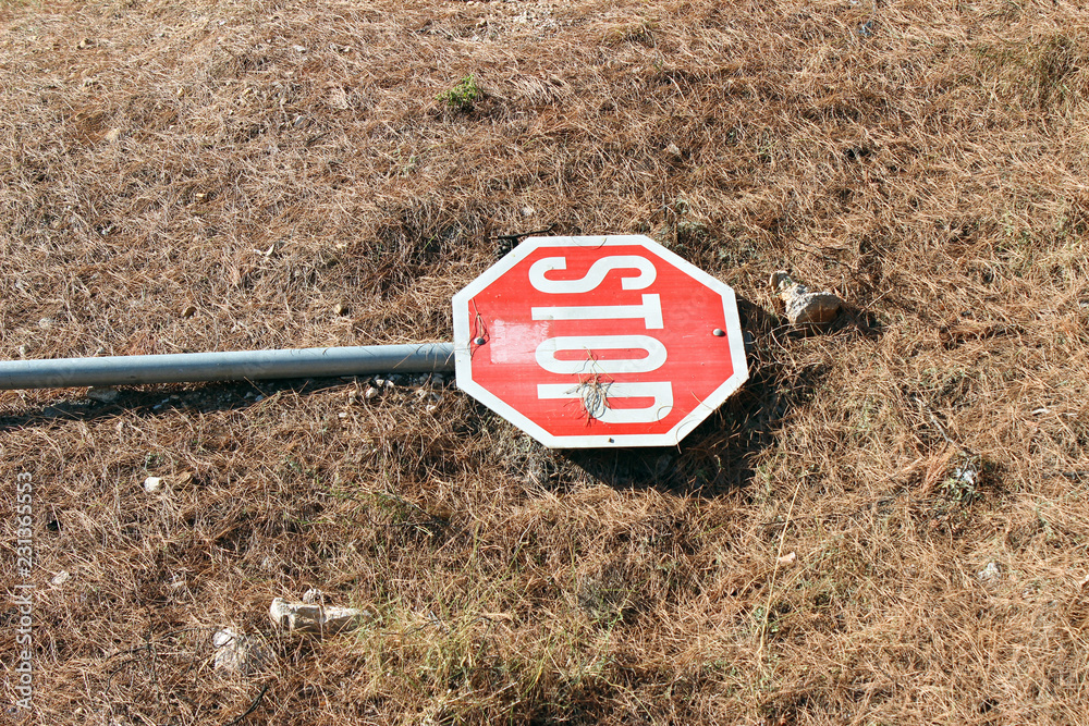 Broken stop traffic sign on the ground concrete base horizontal Stock ...