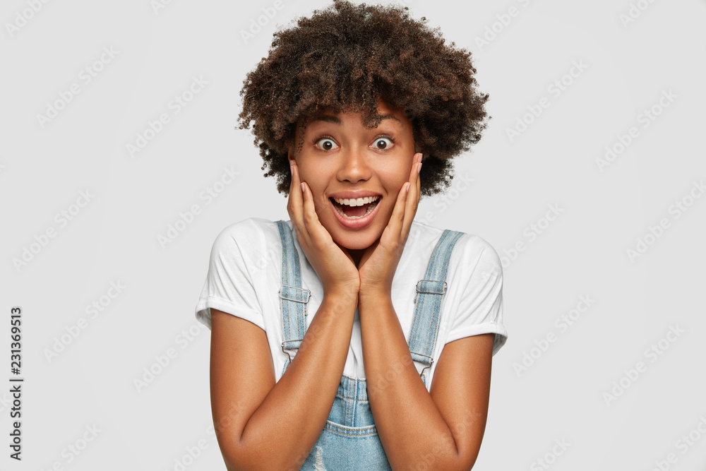 Emotions and reaction concept. Happy emotional lady with dark healthy ...