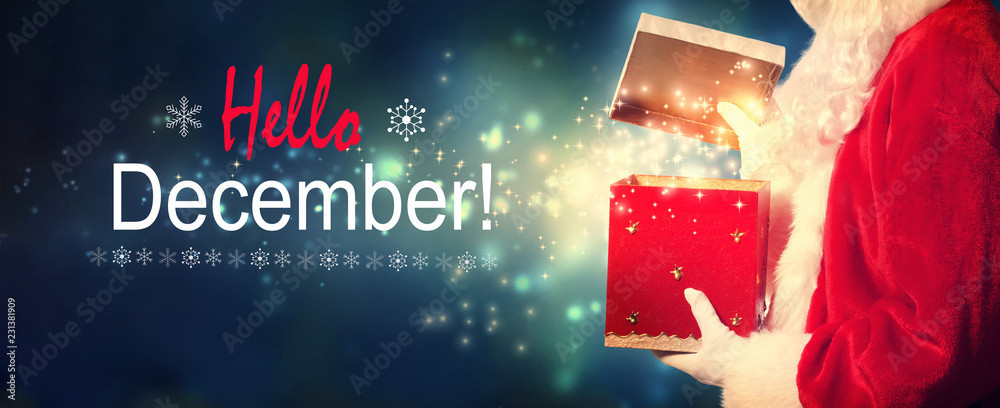 Hello December message with Santa opening a gift box on a shiny light ...