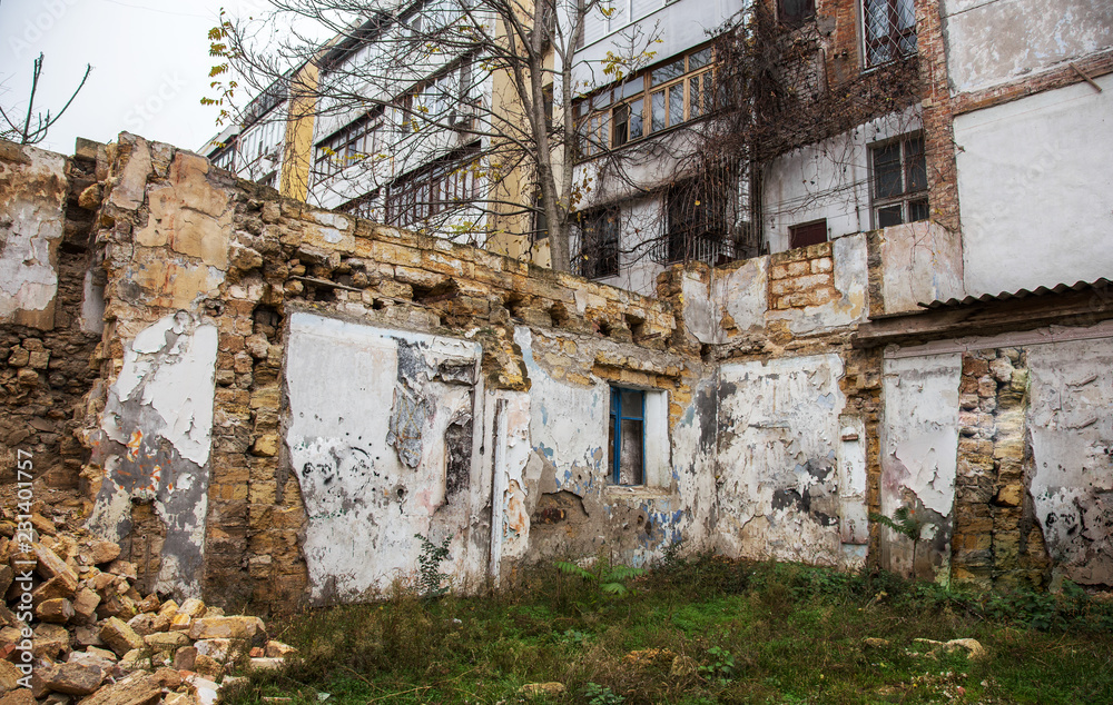 Ruins of an old abandoned city. Ruined house in which poor people live ...