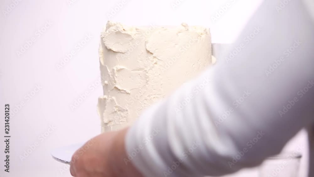 Step by step. Icing tall birthday cake with white buttercream icing ...