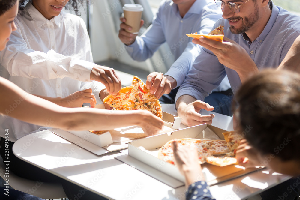 Diverse business office people group taking sharing pizza slices from ...
