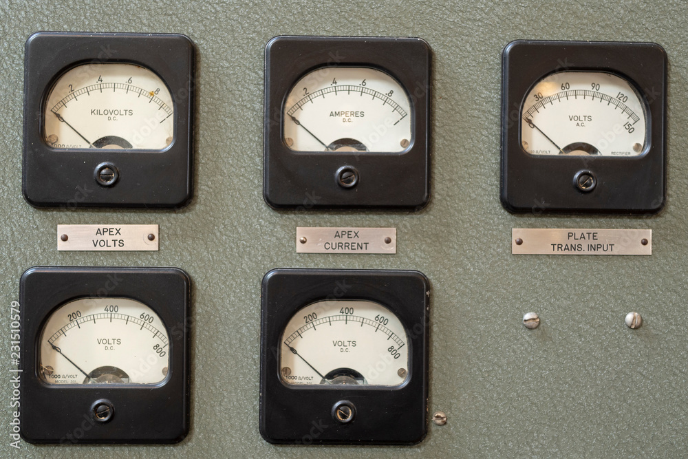 Analog dials on wall panels showing current and volts. Stock Photo ...