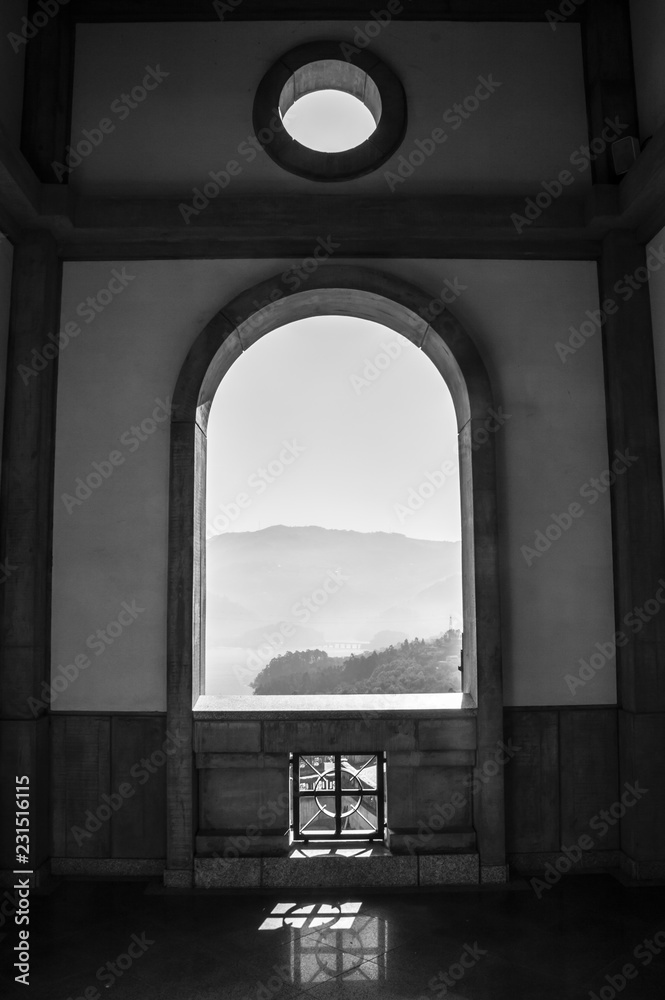 Black and white picture of a landscape with mountains, mist and a lake ...