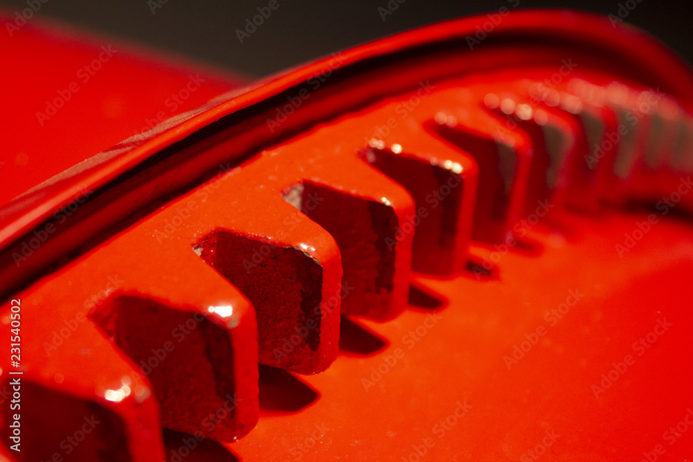 Teeth of cog-wheel of capacity of concrete-mixer Stock Photo | Adobe Stock