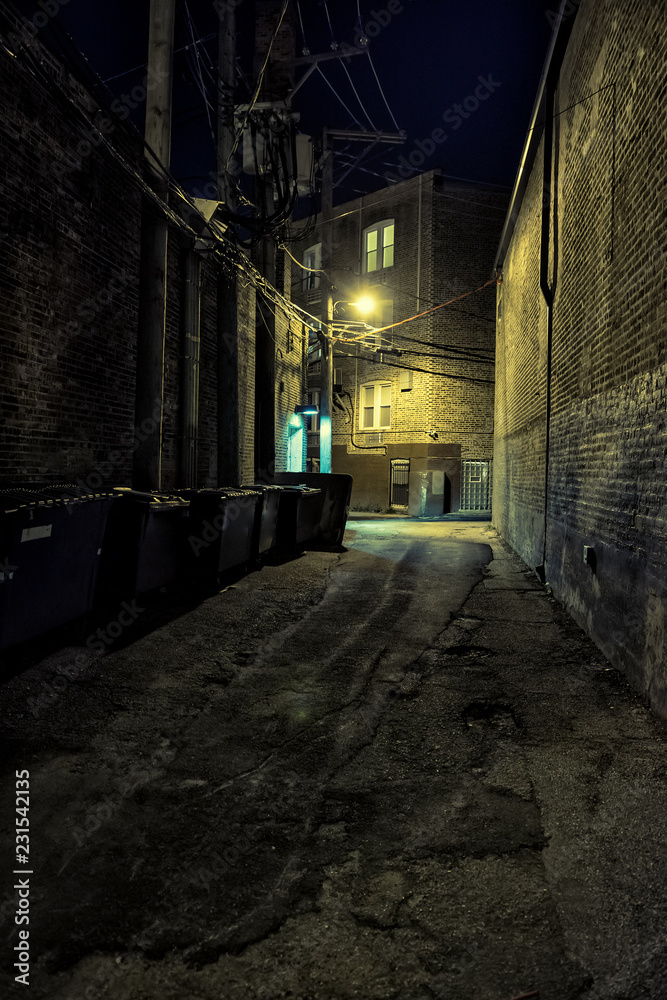 Dark and scary downtown urban city street corner alley with an eerie ...