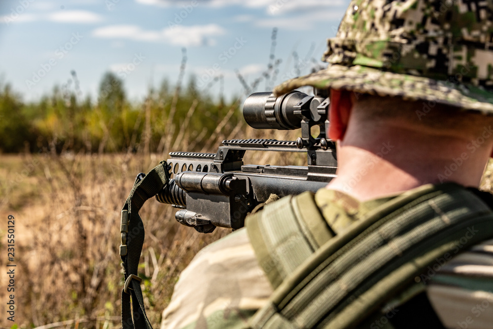 special forces, soldier assault rifle with silencer, optical sight ...