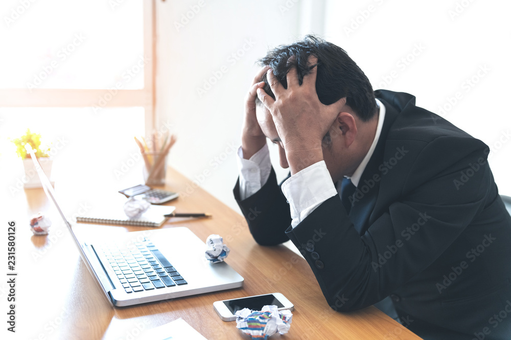 Tired depressed black businessman at workplace frustrated by business ...