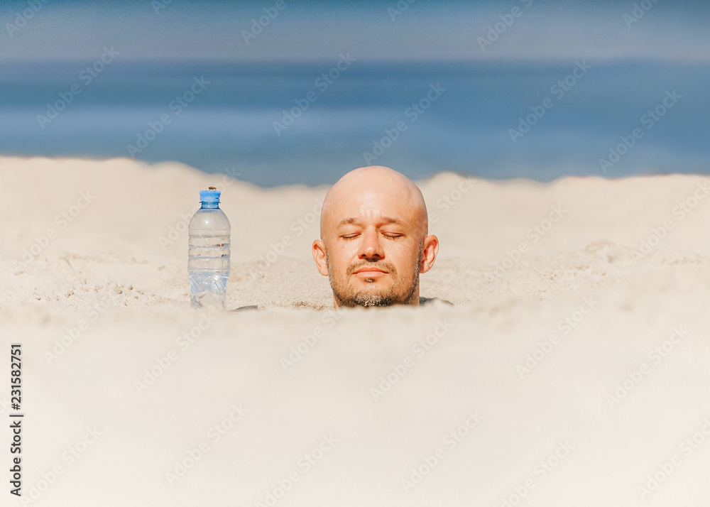 Buried till head bald man. Suffering of thirsty male in desert. Young ...
