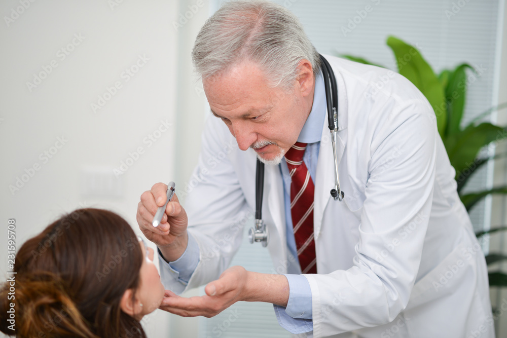 Doctor checking patient eyes Stock Photo | Adobe Stock