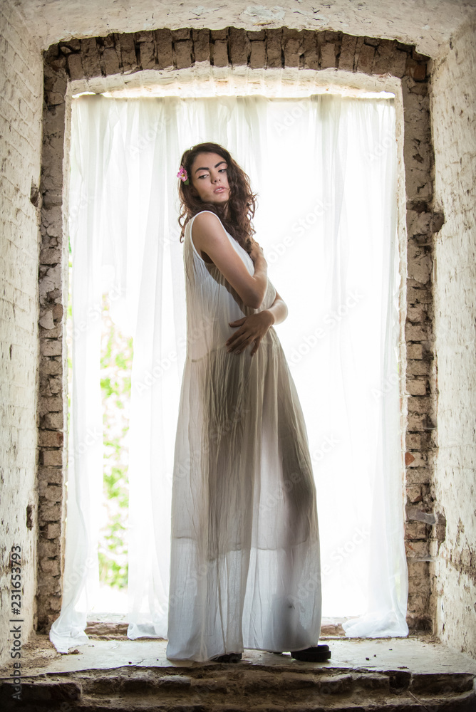 Beautiful woman in white transparent dress Stock Photo | Adobe Stock