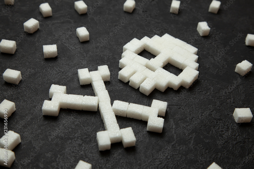 Skull from white sugar cubes on black background. Sugar kills and lot ...
