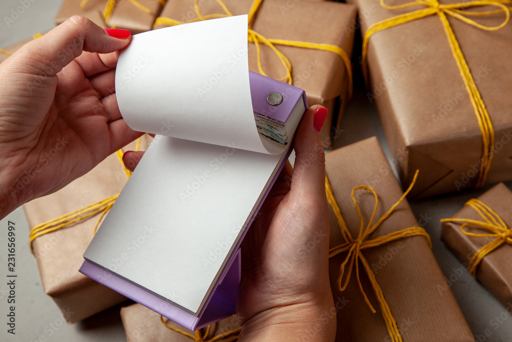 Girl is holding empty tear-off calendar and many gift boxes. Calendar ...