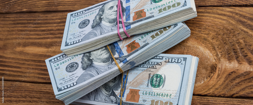 Thirty thousand dollars in packs on a table of textured boards. Stock ...