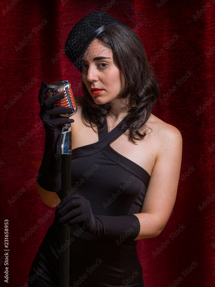 Young vintage singer, behind a microphone Stock Photo | Adobe Stock