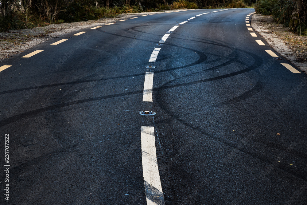 Car tyre skid marks on a rural road Stock Photo | Adobe Stock