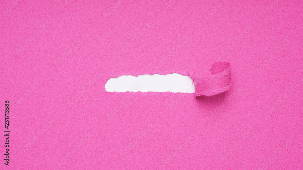 tearing off paper shred to reveal hidden copy space underneath - pink ...