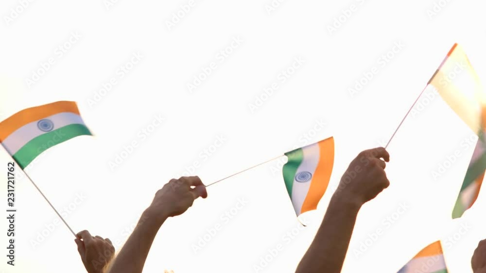 Hands waving the flags of India. Indian patriotics holding small flags ...