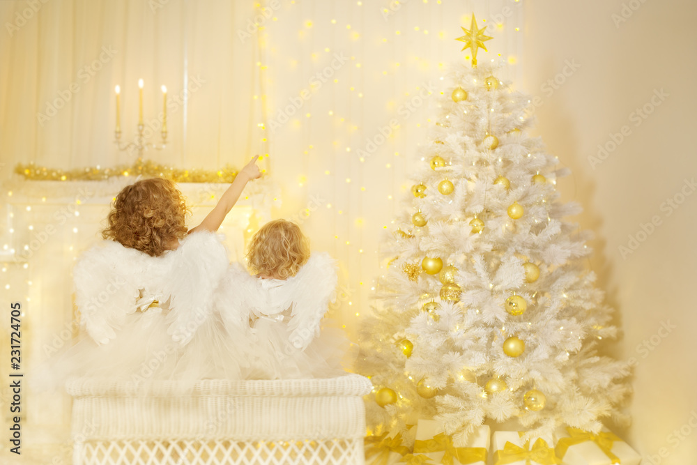 Christmas Angels looking to Xmas Tree, Children with Wings Back View ...