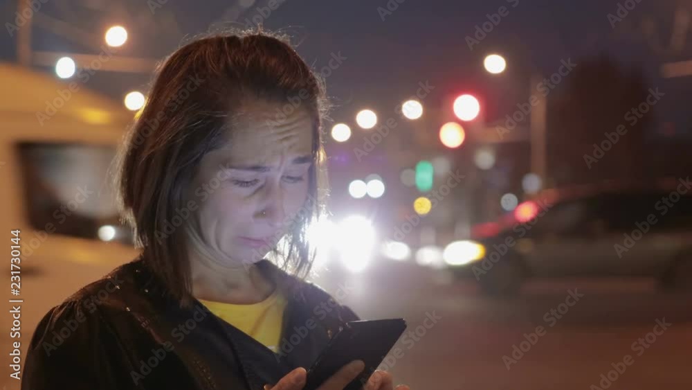 Excited, young girl with short hair and leather jacket talking on the ...